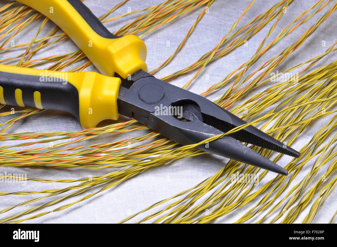 Electrical tools and cables on grey metal surface Stock Photo - Alamy