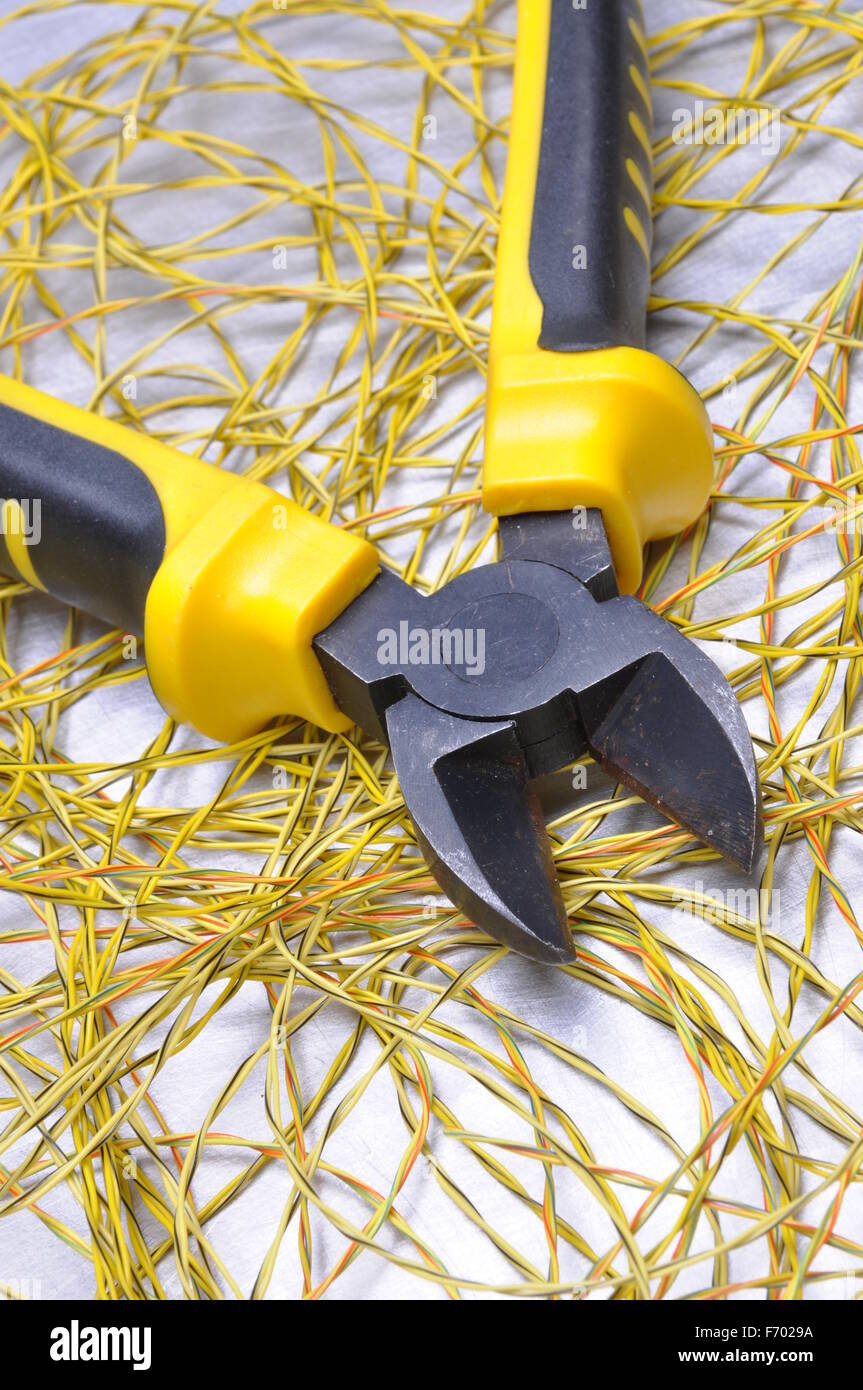 Electrical tools and cables on grey metal surface Stock Photo - Alamy