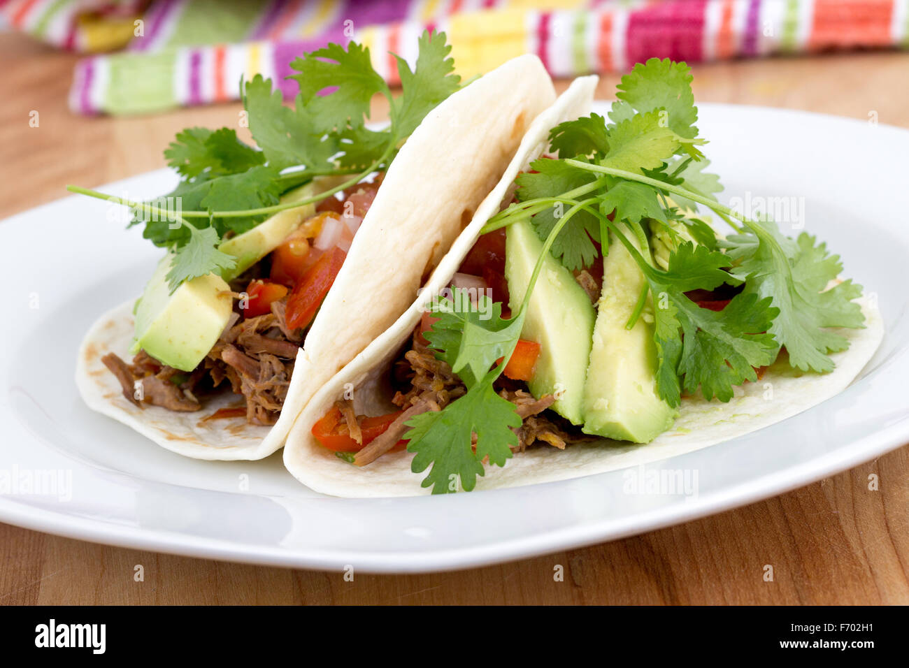 pulled pork soft taco with avocado and cilantro Stock Photo - Alamy