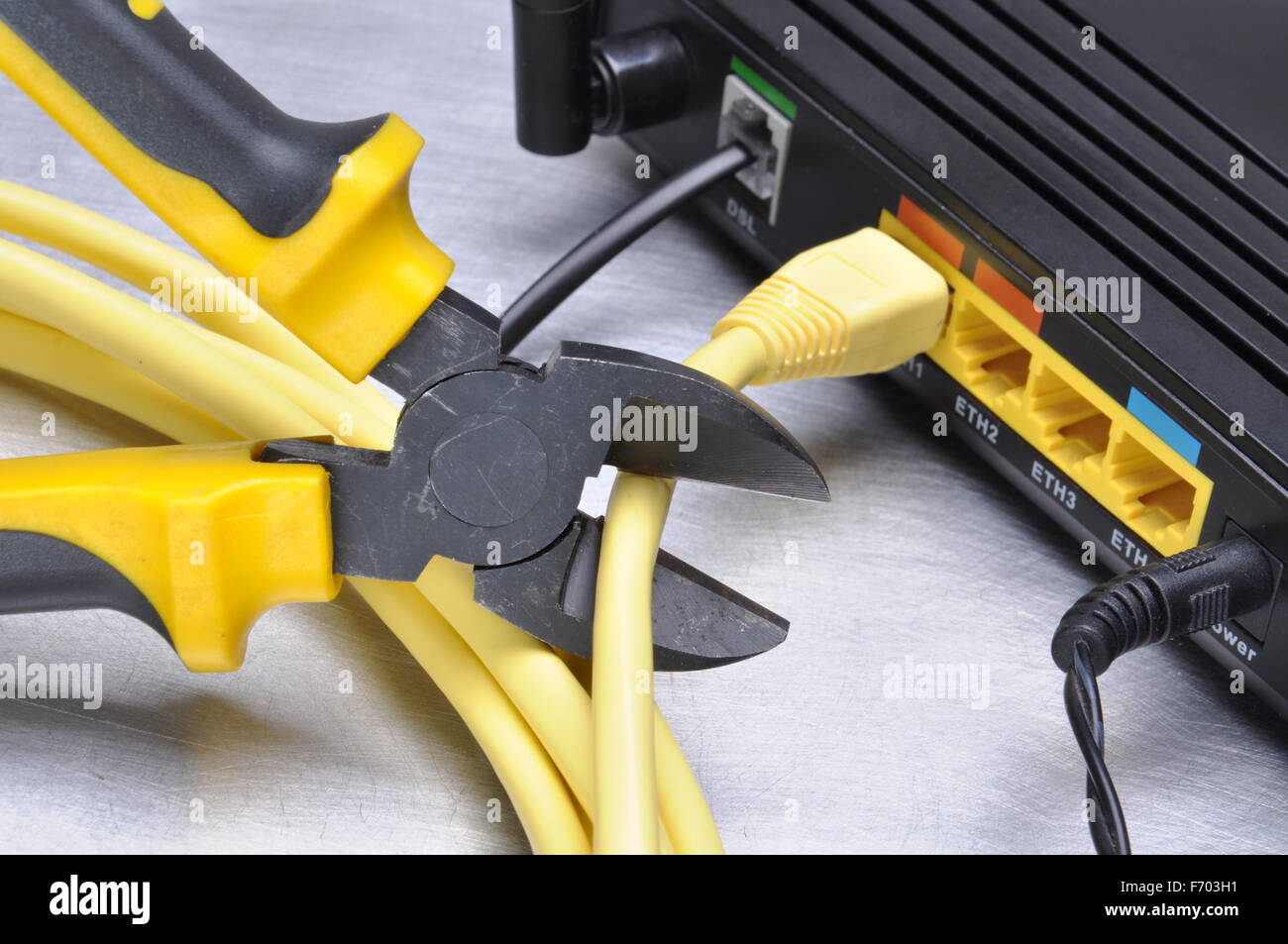 Cutting access to the Internet, cable to the router Stock Photo - Alamy