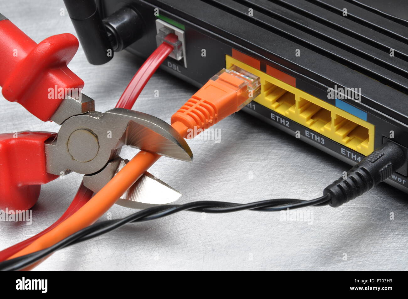 Cutting access to the Internet, cable to the router Stock Photo - Alamy