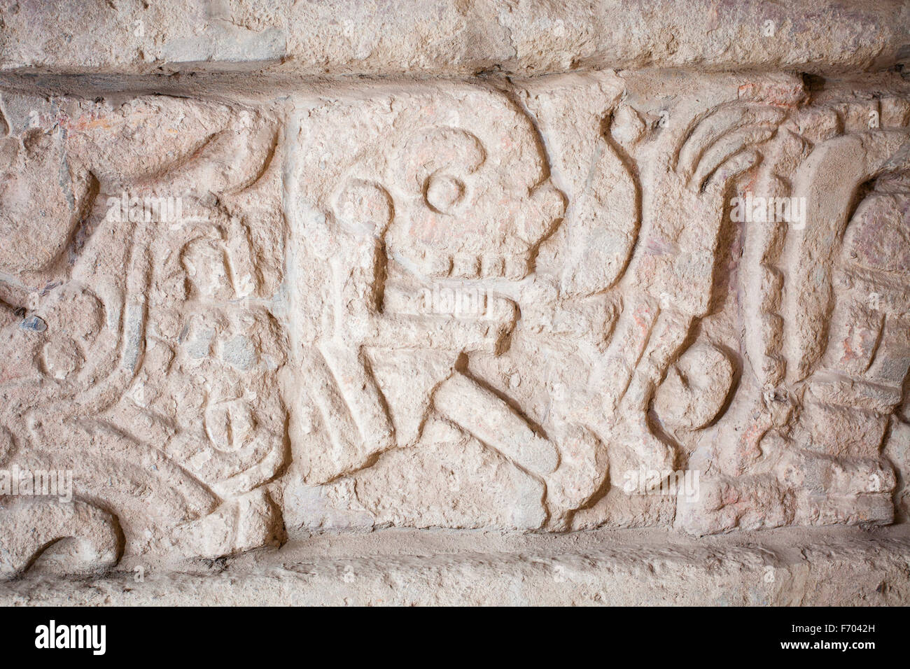 Recurring relief of a human skull carved on the base of the main ...