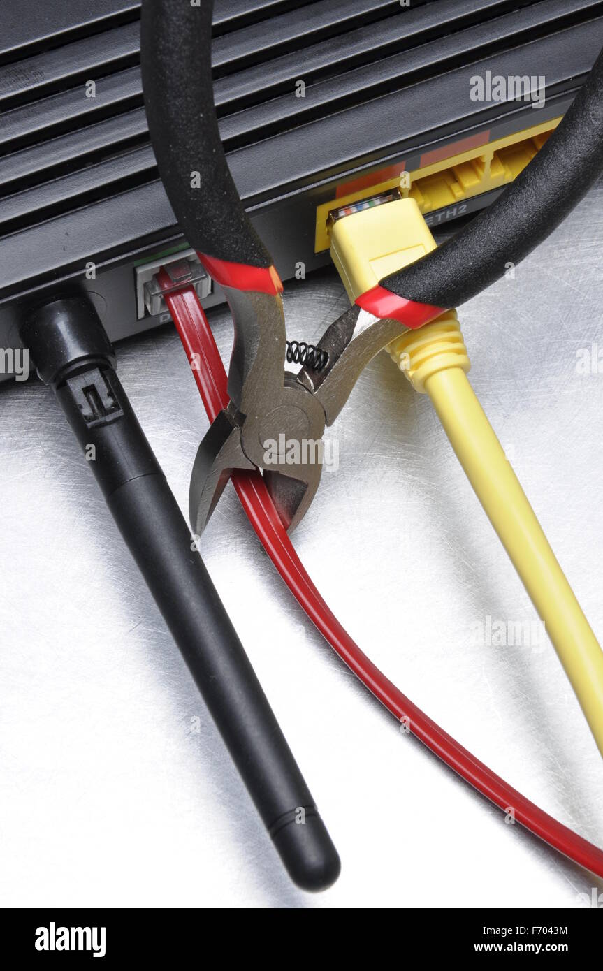 Cutting access to the Internet, cable to the router Stock Photo - Alamy