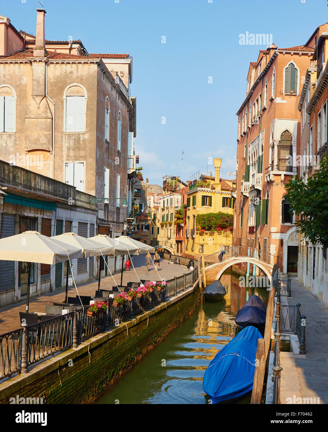 Canalside seating and small bridge Castello Venice Veneto Italy Europe ...