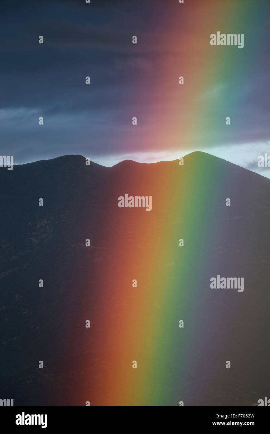 Oak View, California, USA, March 1, 2015, full rainbow over rain storm ...