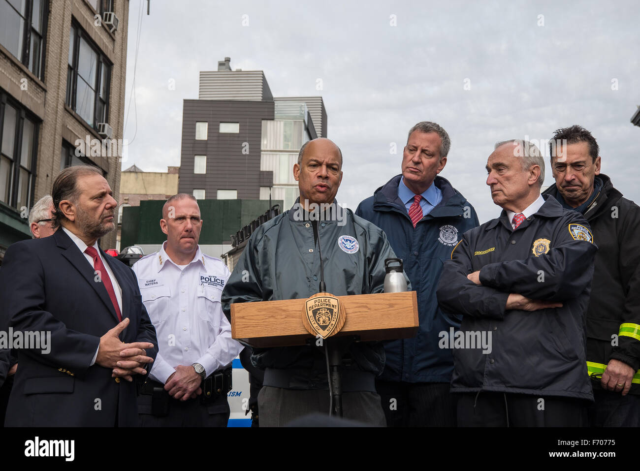 U.S. Homeland Security Secretary Jeh Johnson (center) flanked by NYC ...