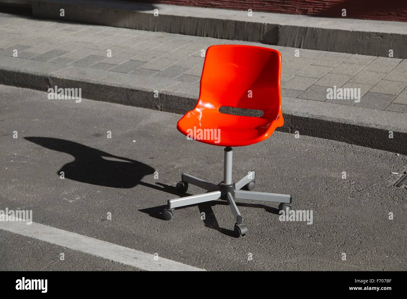 Office chair on the street Stock Photo - Alamy