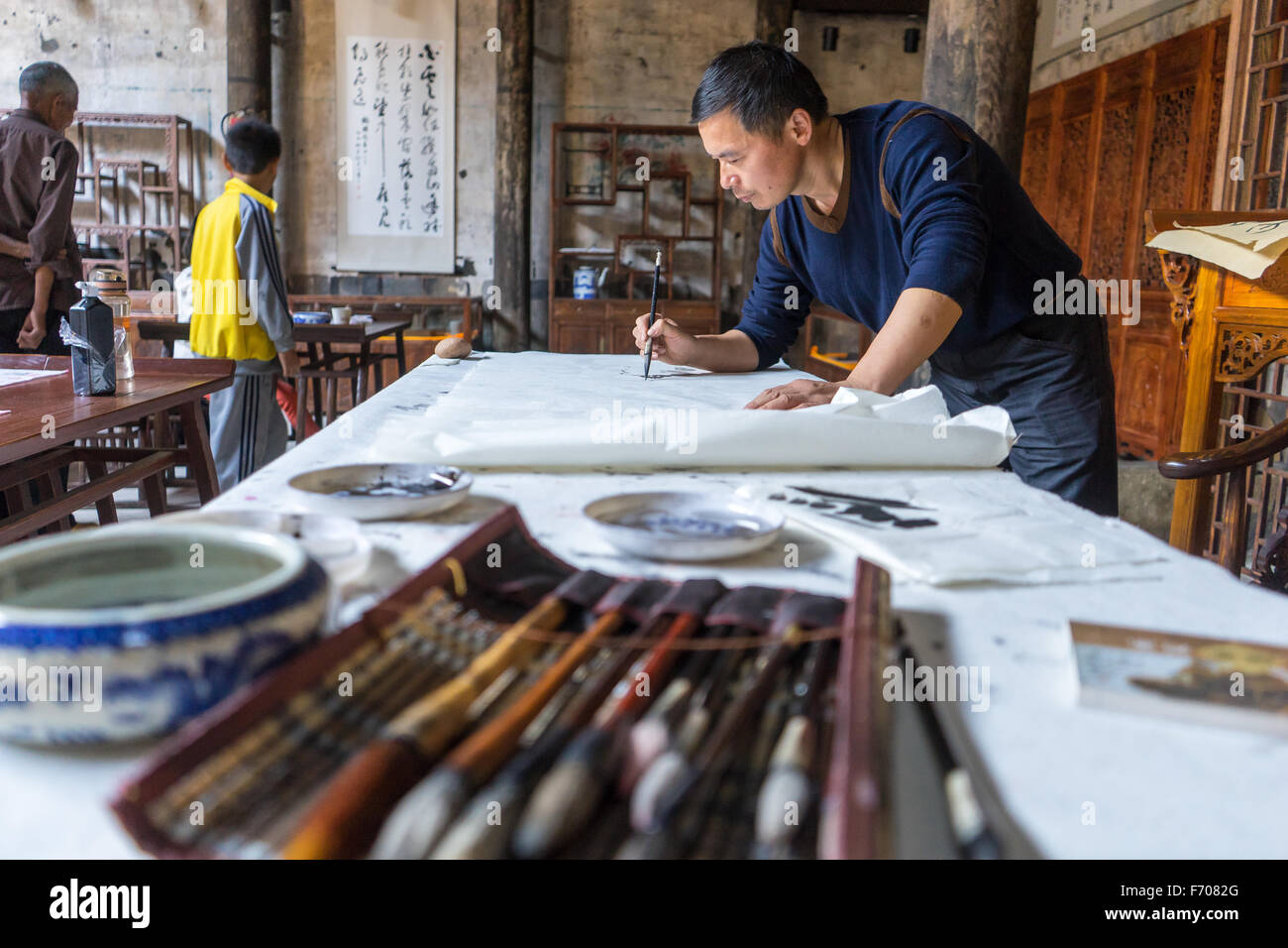 Teacher in a school teaching calligraphy calligraphy, Siping Village ...
