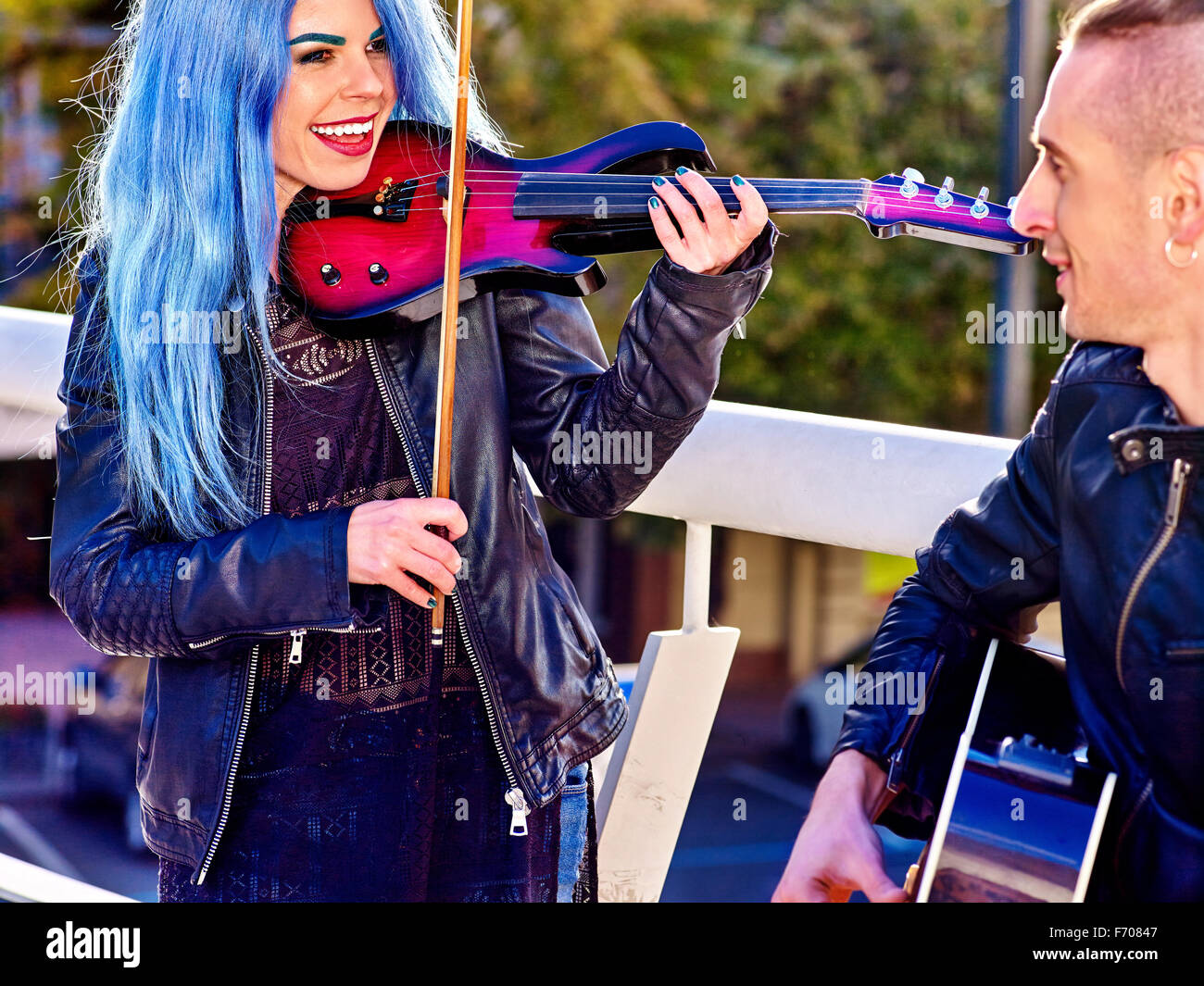 Music street performers with girl violinist Stock Photo - Alamy