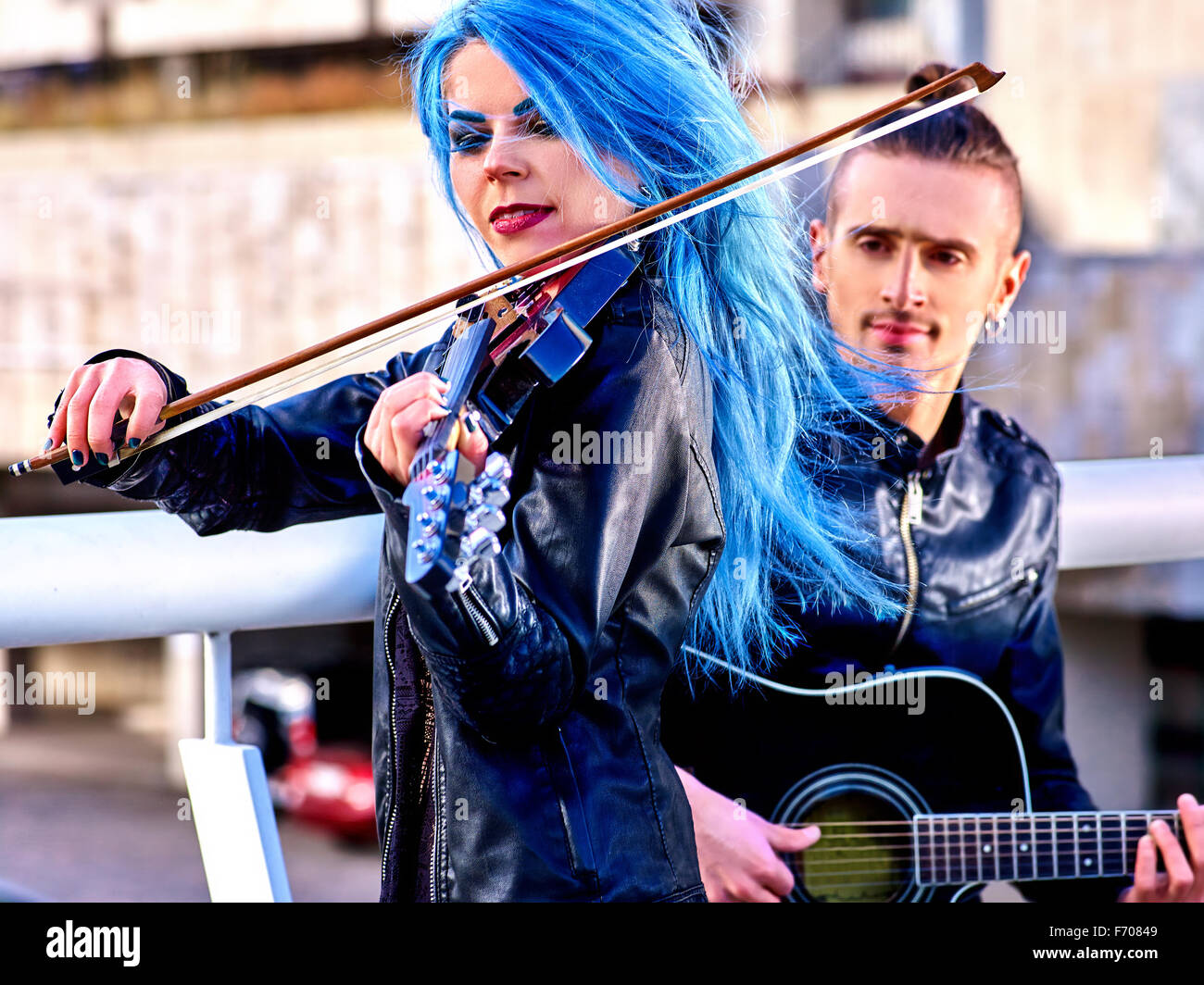 Music street performers with girl violinist Stock Photo - Alamy
