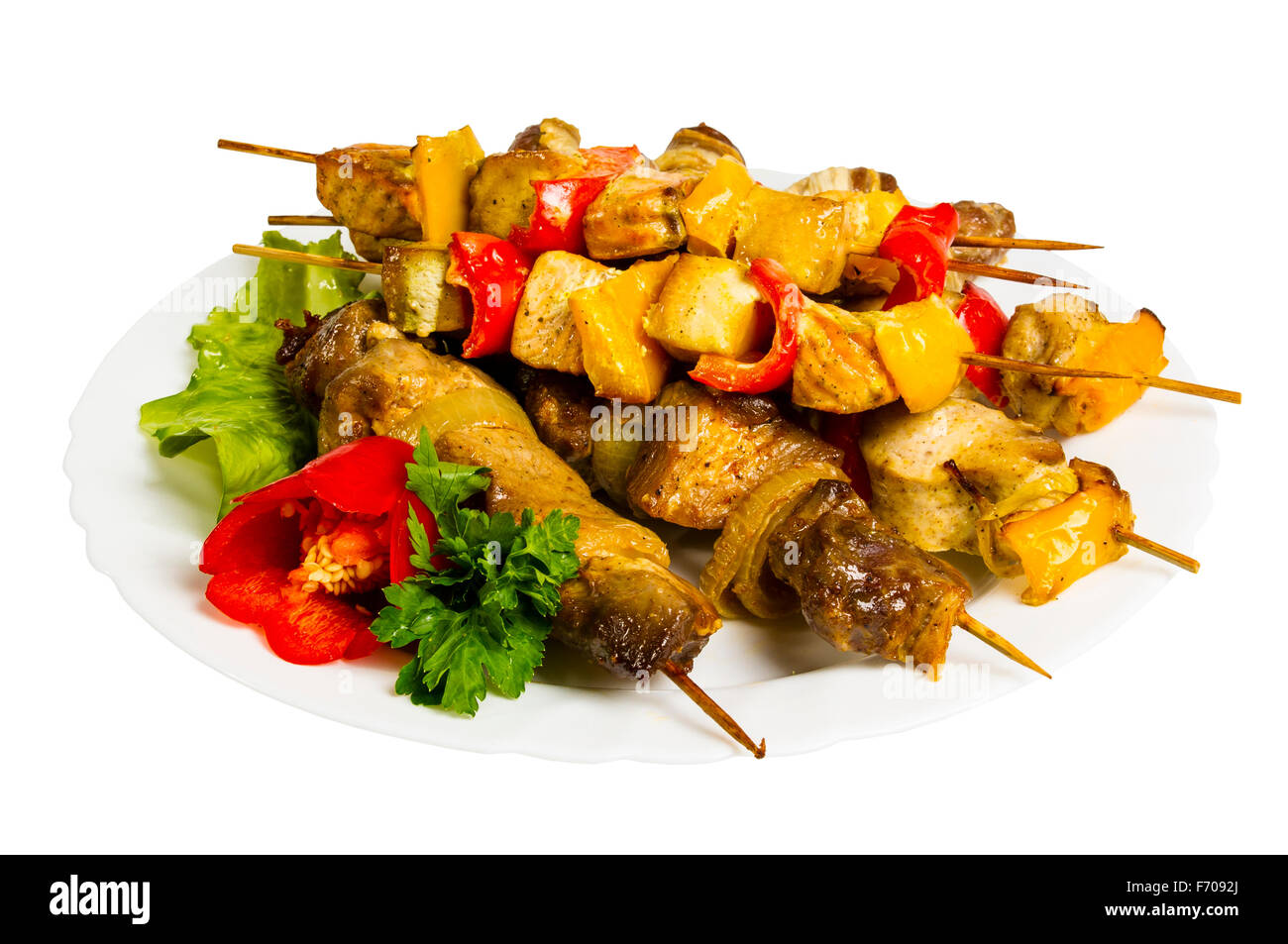 grilled fish with greens on the plate, isolated on white background ...