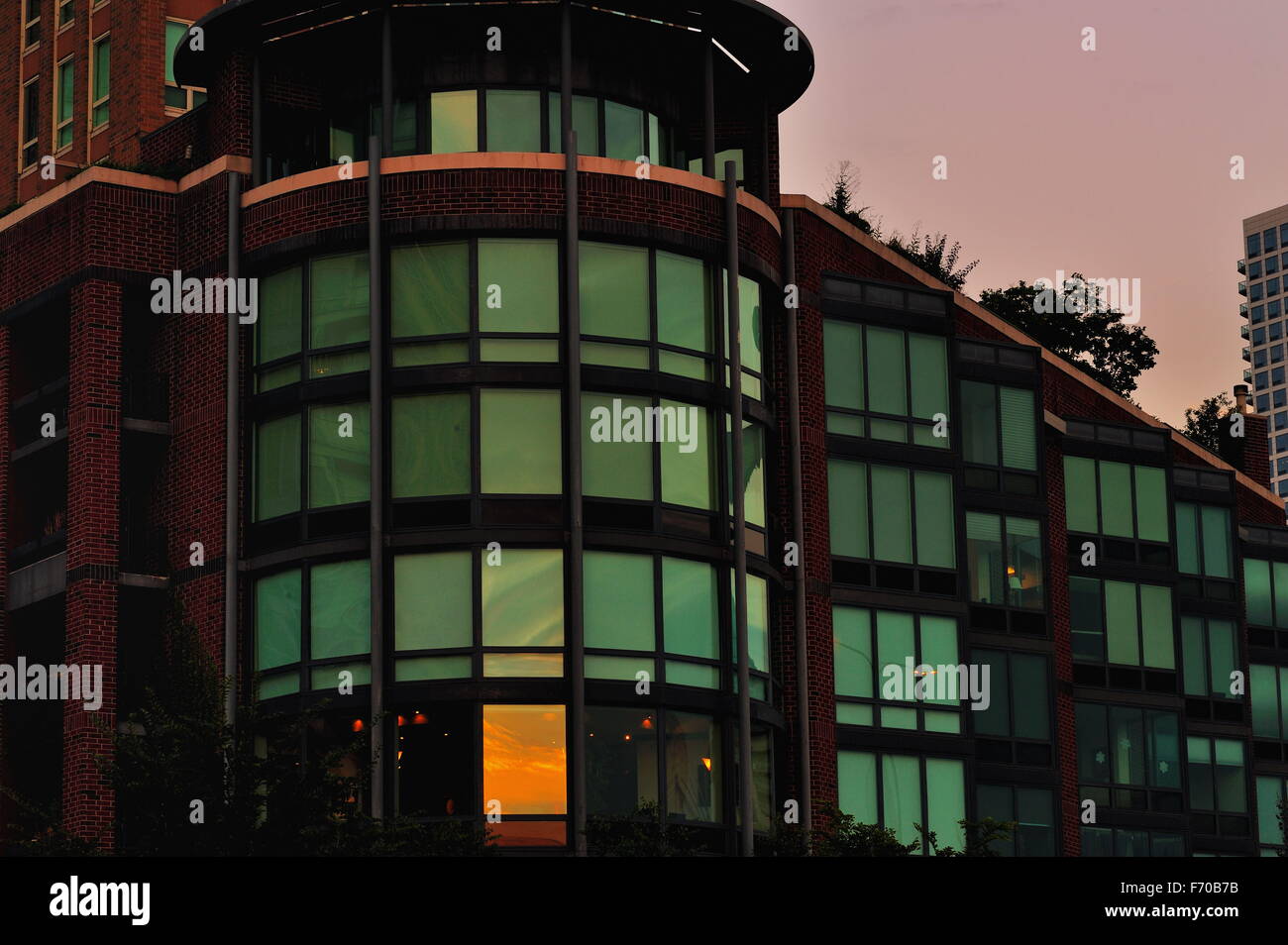 A modern low-rise residential building along the Chicago River has a ...