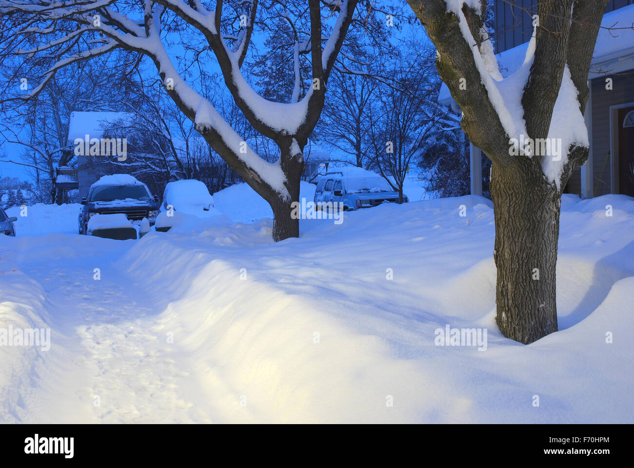 Courtyard and parking lot of an apartment complex after a heavy snow ...