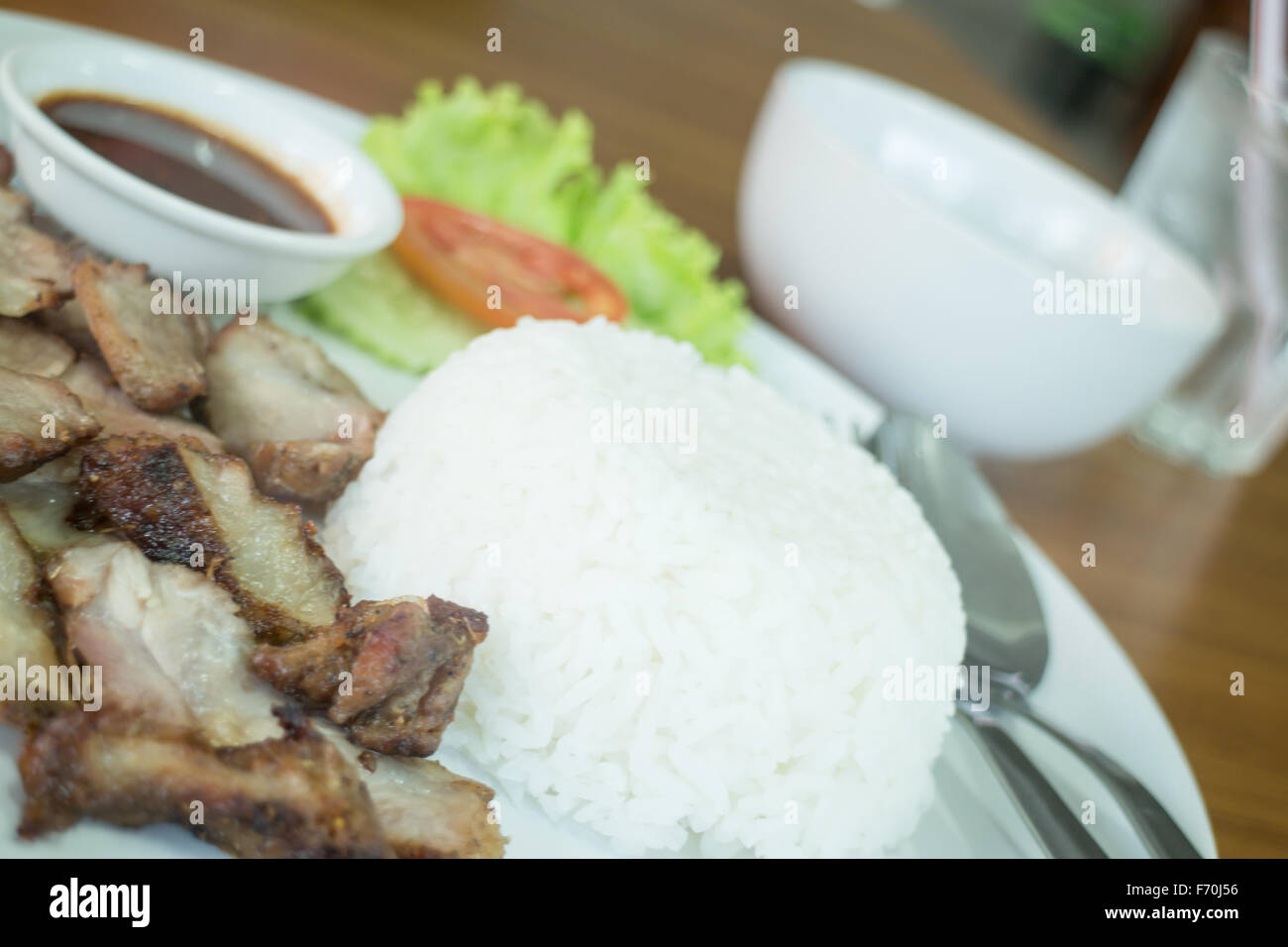 Spicy grilled pork with rice dish, stock photo Stock Photo - Alamy