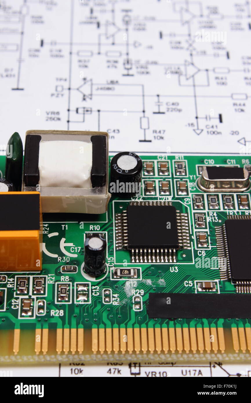 Printed circuit board with electrical components lying on construction ...