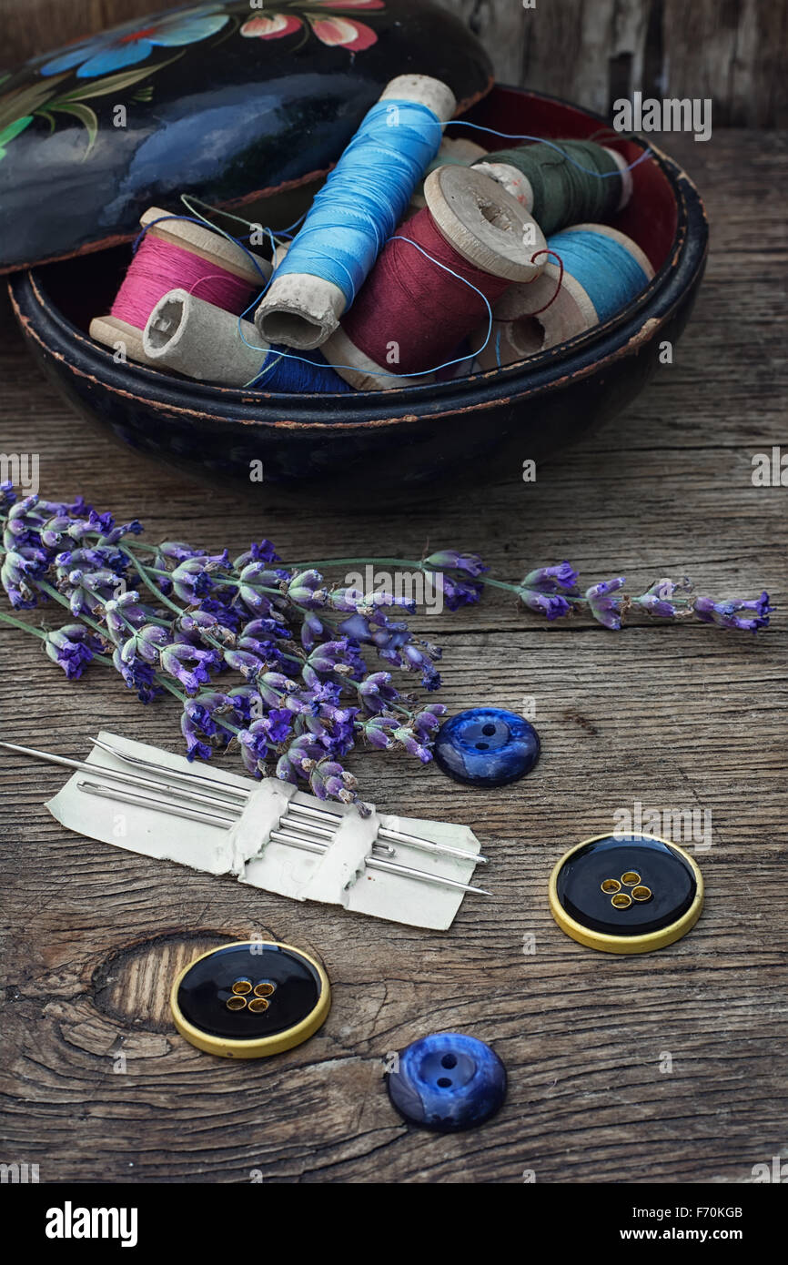 Box with reels of thread and buttons and fresh lavender Stock Photo - Alamy