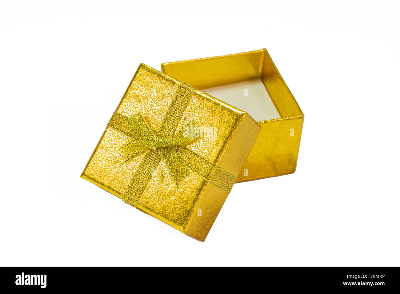Golden gift box with golden ribbon on white background Stock Photo - Alamy