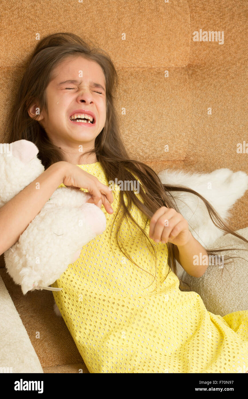 Girl crying on chair hi-res stock photography and images - Alamy