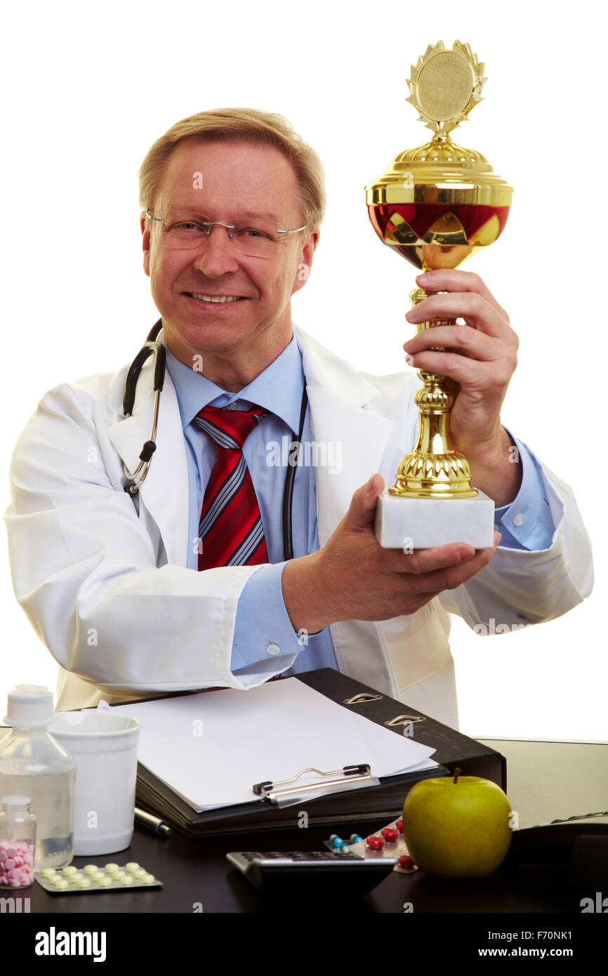 Proud senior doctor holding a big trophy Stock Photo - Alamy