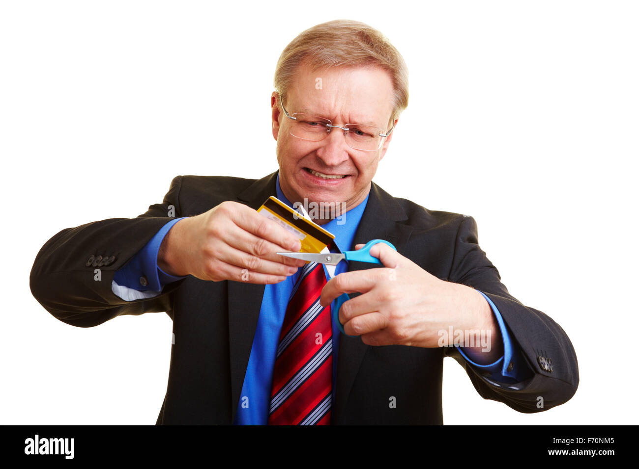Angry senior businessman cutting his credit card Stock Photo - Alamy