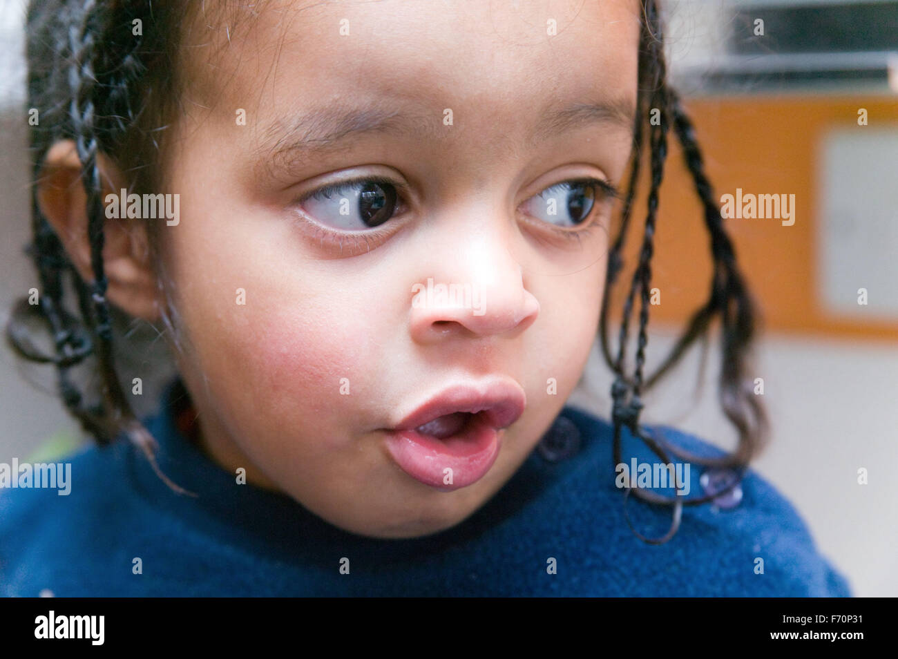 Portrait of a little boy looking puzzled Stock Photo - Alamy