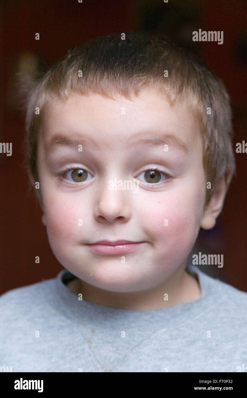 Portrait of a little boy looking puzzled Stock Photo - Alamy