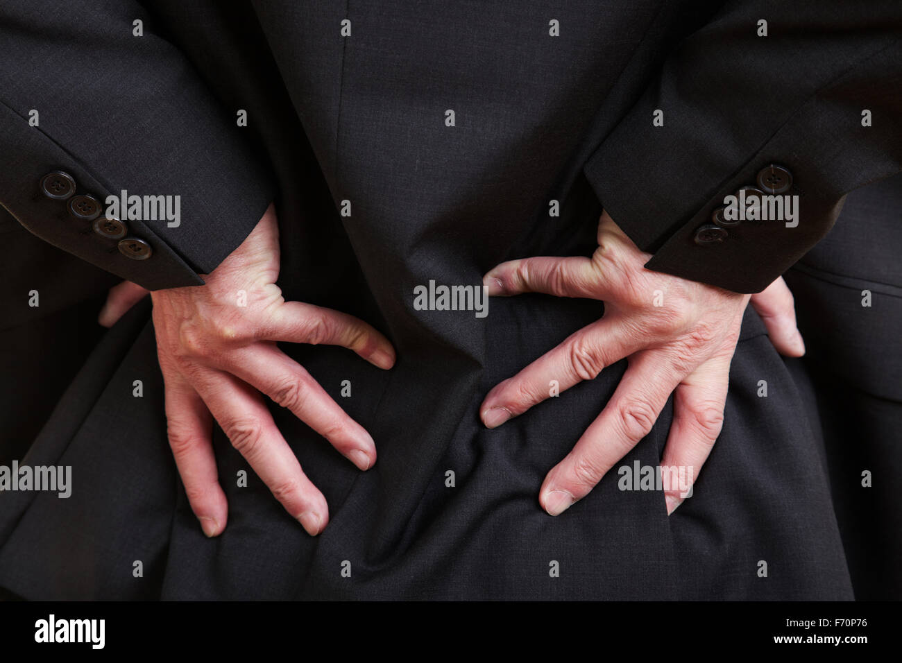 Old man hands behind back hi-res stock photography and images - Alamy