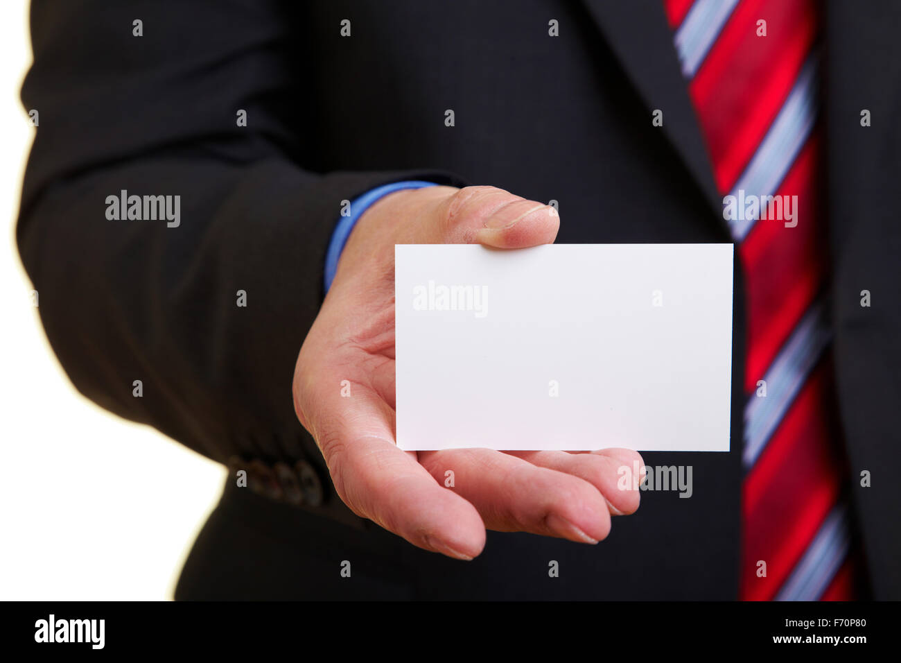 Senior businessman holding a white business card Stock Photo - Alamy