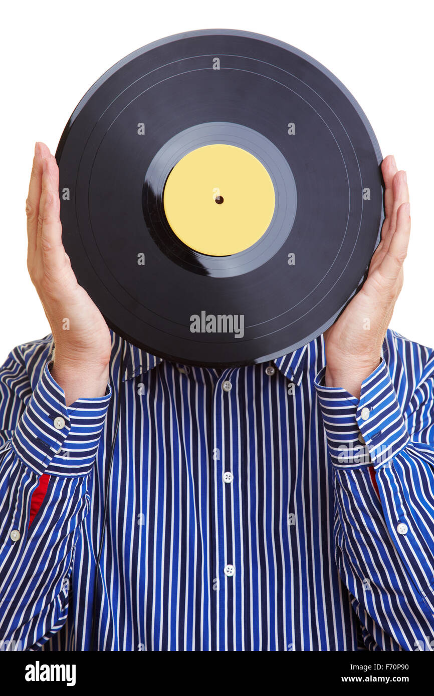 Man holding a record in front of his face Stock Photo - Alamy