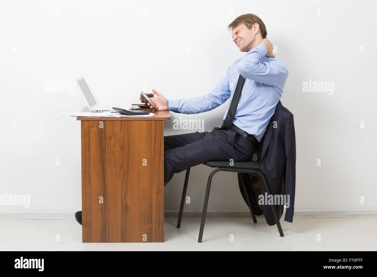 Businessman Using Computer Suffering From Neck Ache Stock Photo - Alamy