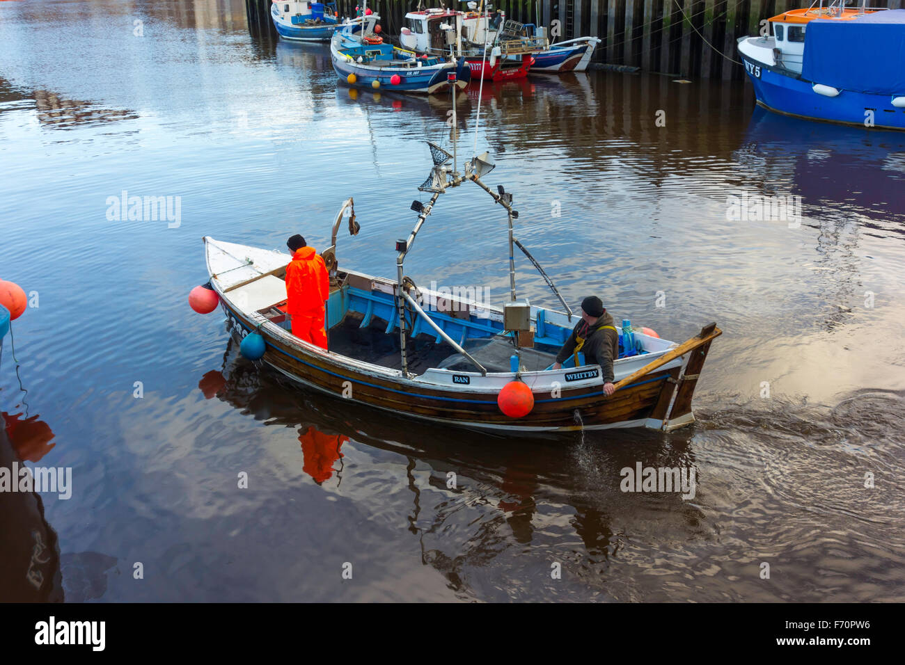 Two Fisherman in their boat WY803 RAN in Whitby Harbour departing to go ...