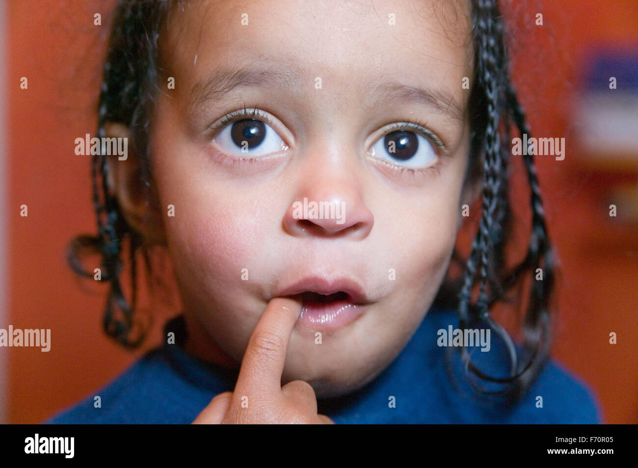 Portrait of a little boy looking puzzled Stock Photo - Alamy
