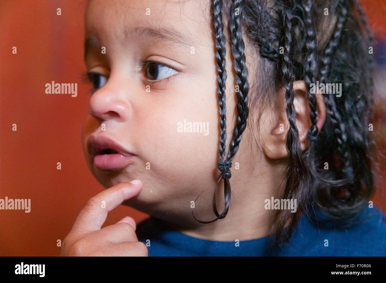 Portrait of a little boy looking puzzled Stock Photo - Alamy