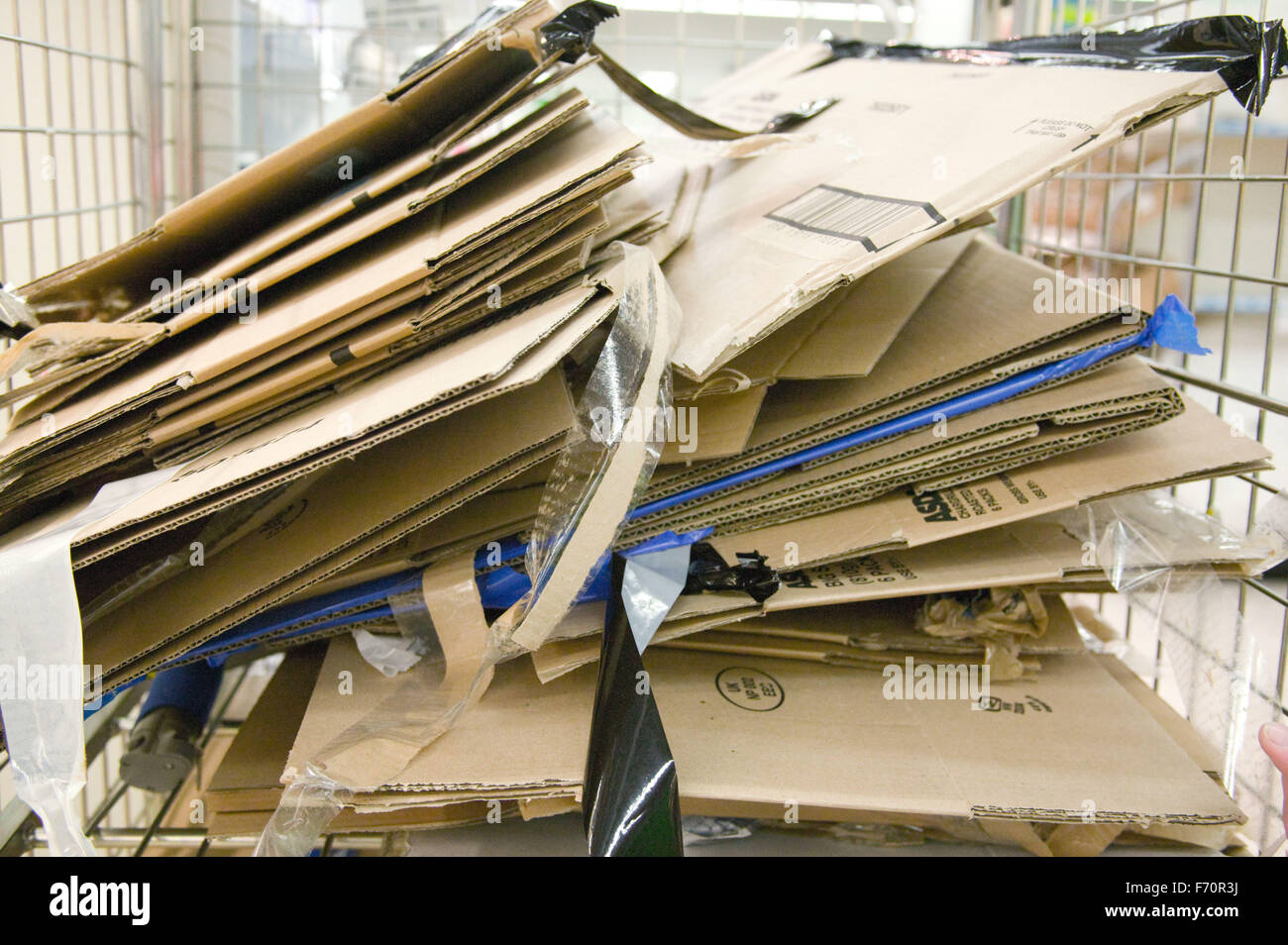 Piles of flatten cardboard boxes at a supermarket; ready for recycling ...