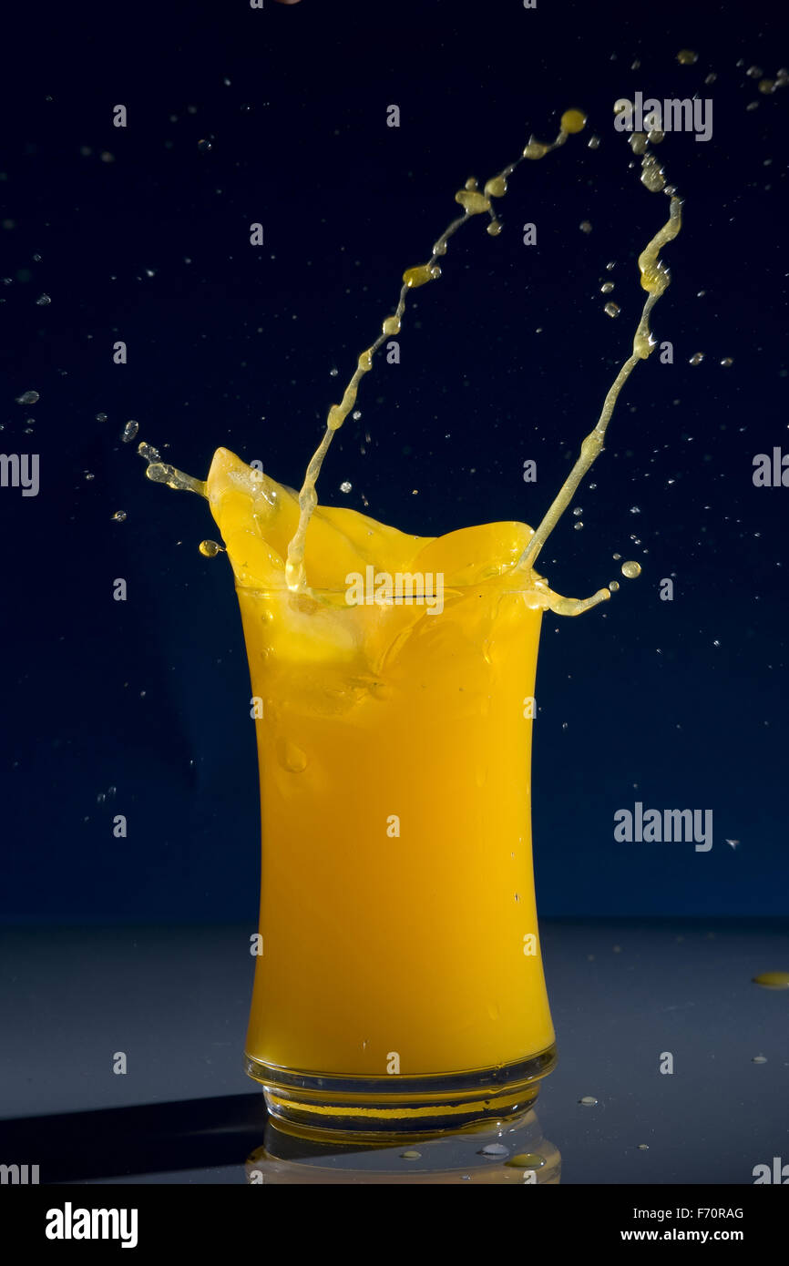 Orange fruit juice splash Stock Photo - Alamy