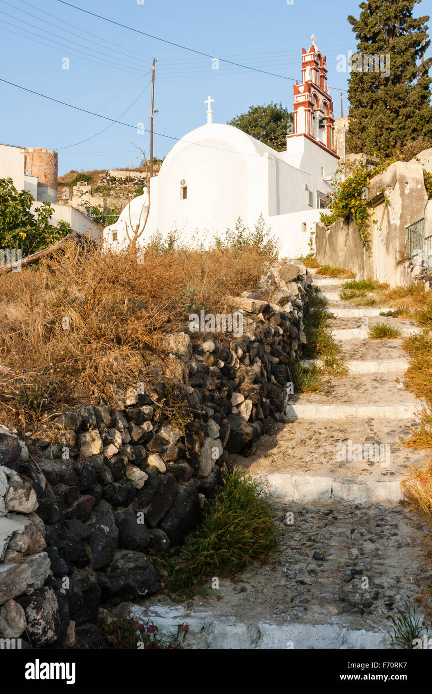 Santorini, Thira. Rural village of Exo Gonia. Long stone steps leading ...