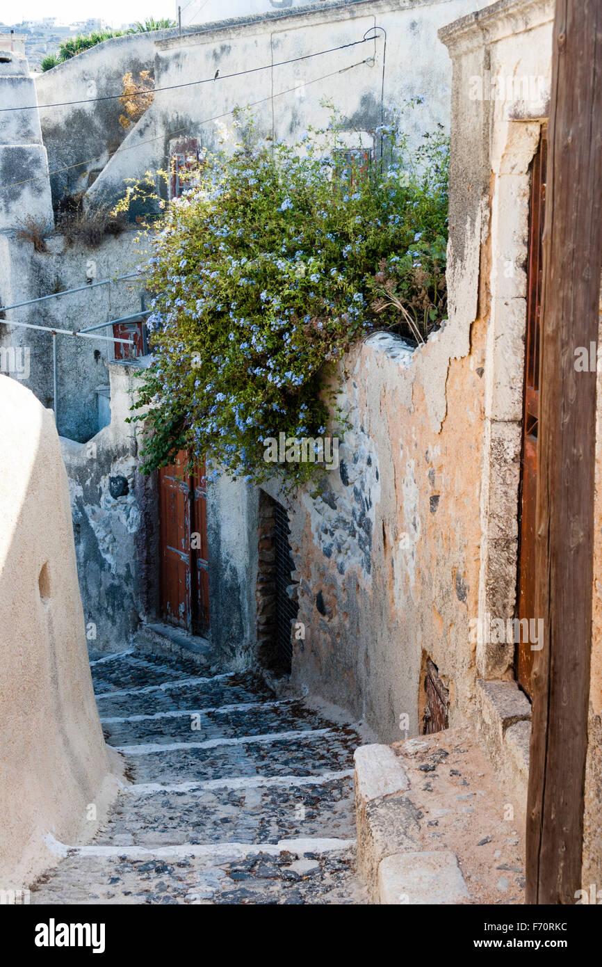 Santorini, Thira. Rural village of Exo Gonia. Long stone steps leading ...