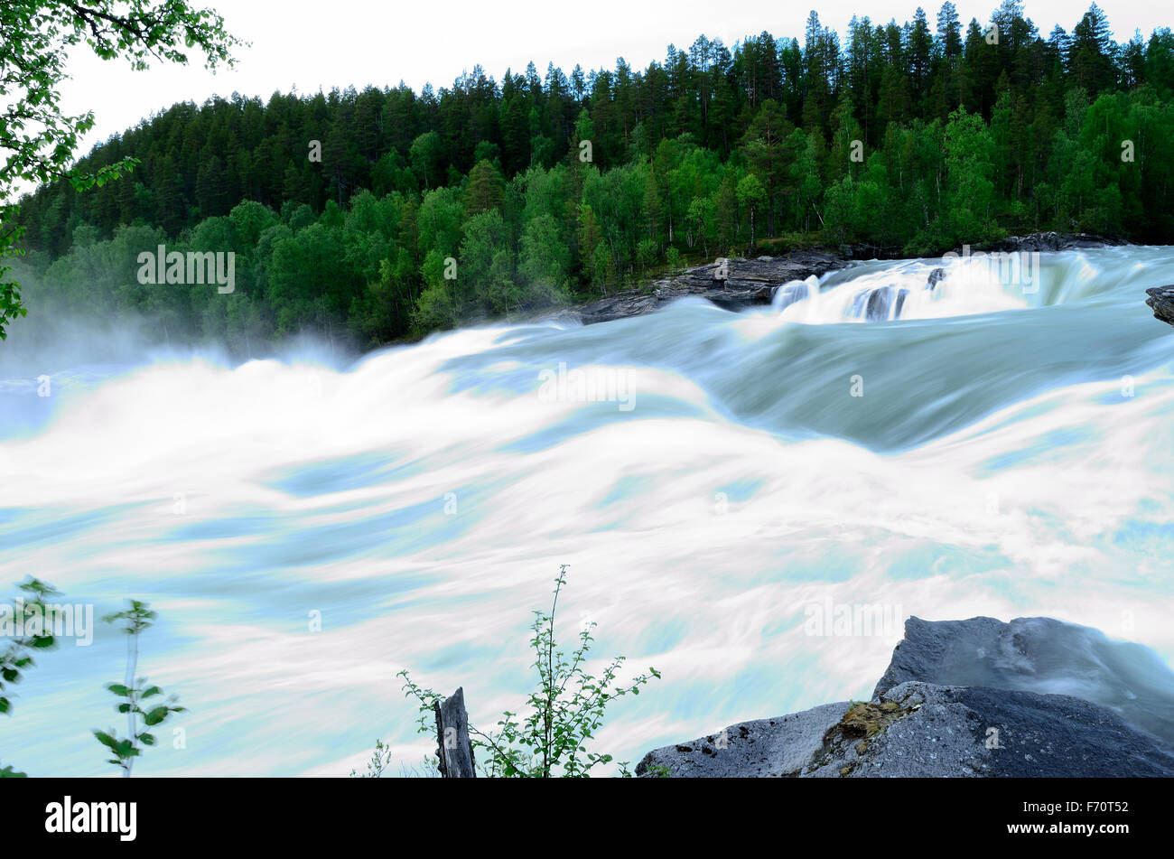 fast flowing rapid river with waterfall Stock Photo - Alamy