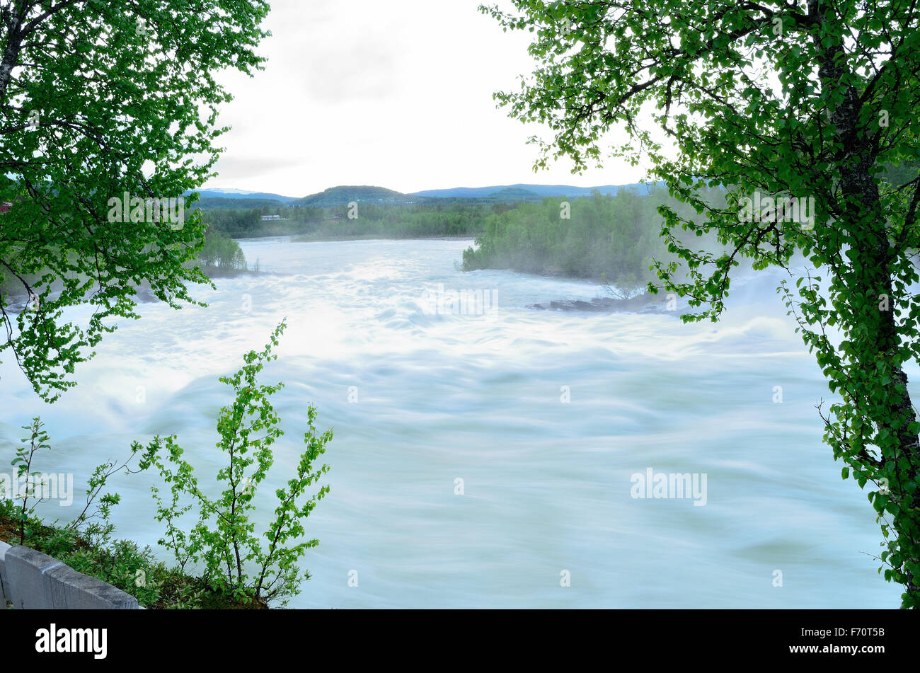 fast flowing rapid river with waterfall Stock Photo - Alamy