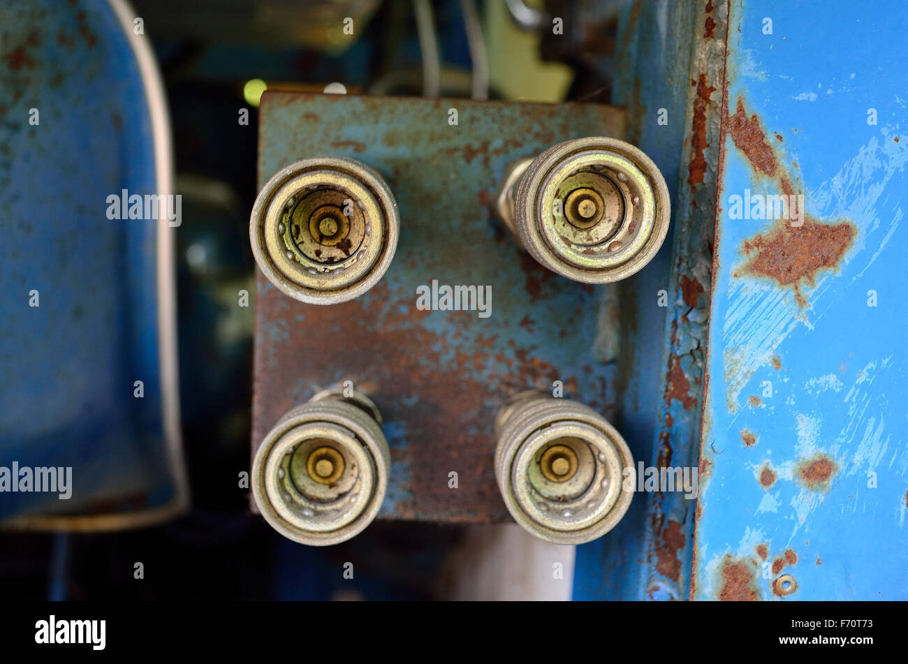four hydraulic oil connection plugs on heavy duty machinery Stock Photo ...