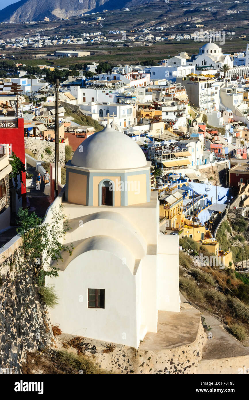 Santorini. White washed Greek orthodox church built on terrace on edge ...