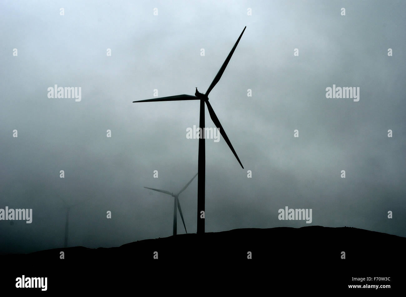windmill on mountain top on dark and rain heavy summer day Stock Photo ...