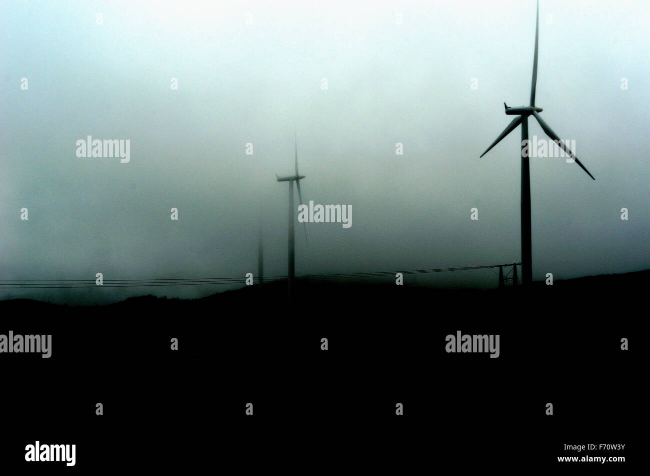 windmill on mountain top on dark and rain heavy summer day Stock Photo ...