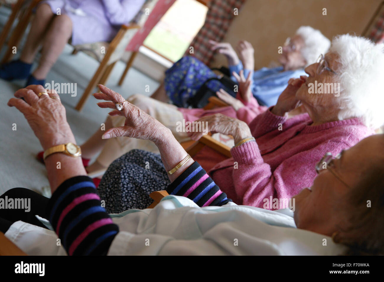 Group of elderly women taking part in a Music and Movement therapy ...