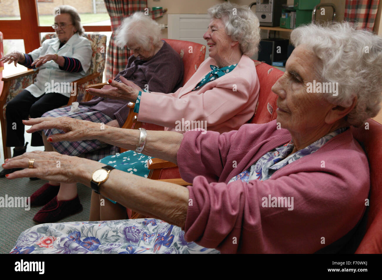 Group of elderly women taking part in a Music and Movement therapy ...