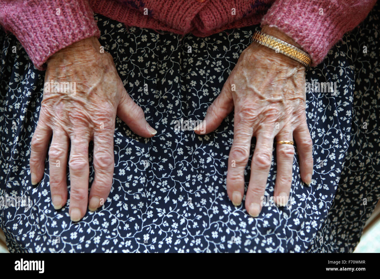 Elderly hands resting on lap hi-res stock photography and images - Alamy
