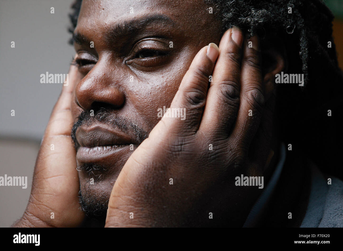 Mental health patient with his face cupped in his hands Stock Photo - Alamy