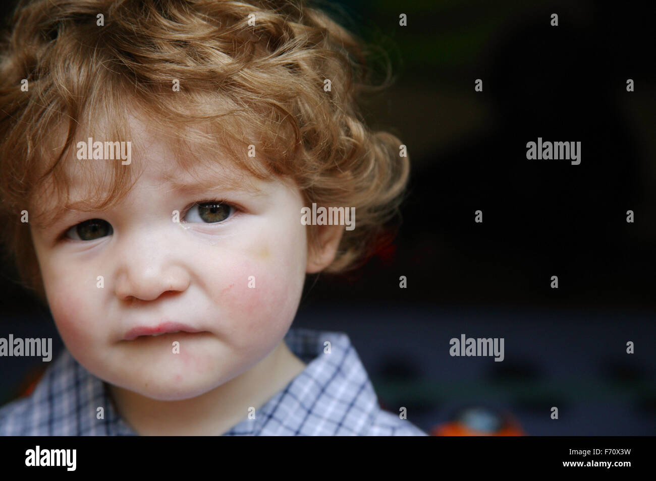 Portrait of baby boy looking puzzled Stock Photo - Alamy