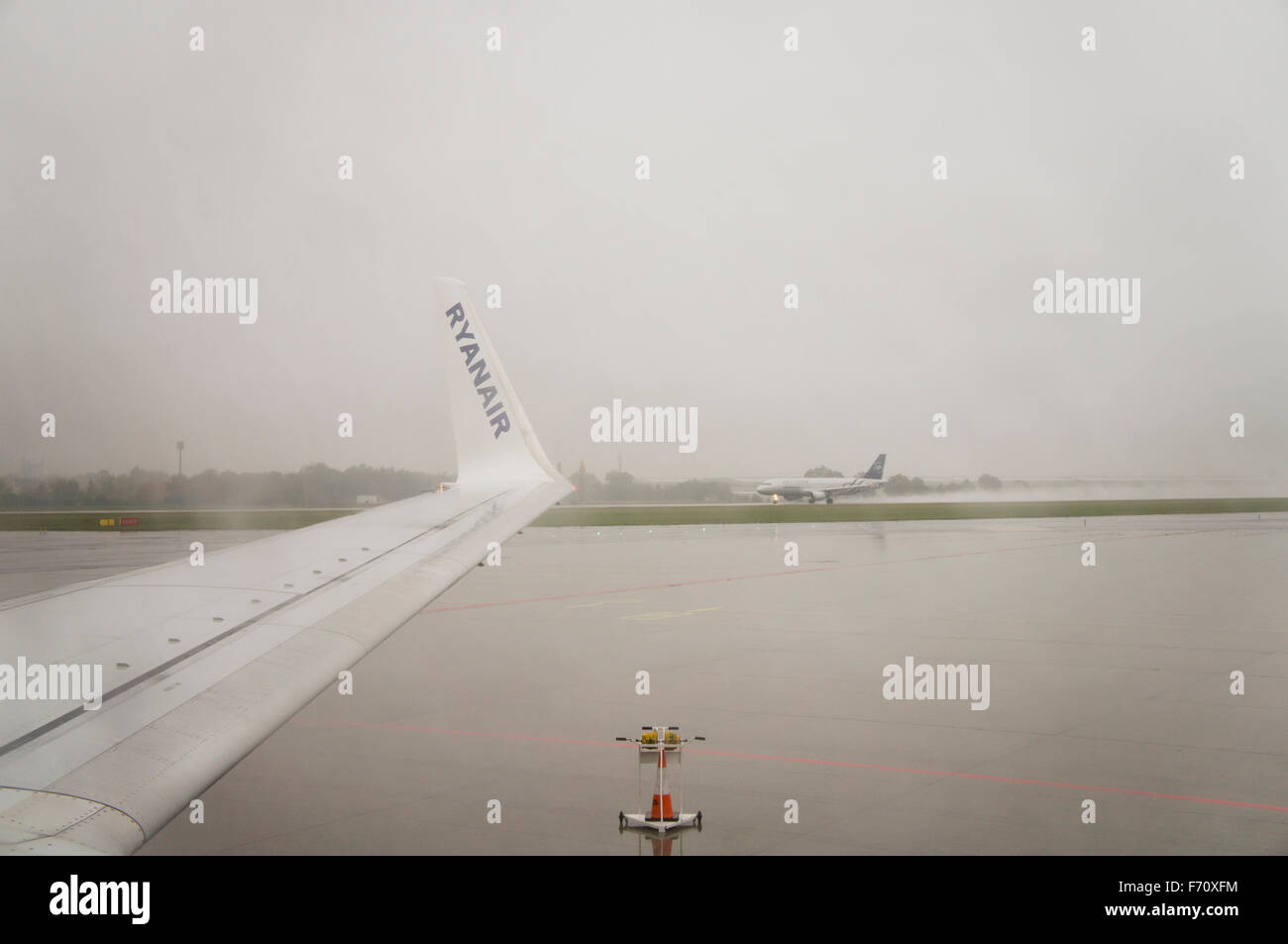 Vaclav Havel Airport Prague, Ruzyne, Ryanair plane Boeing 737-800, rain ...