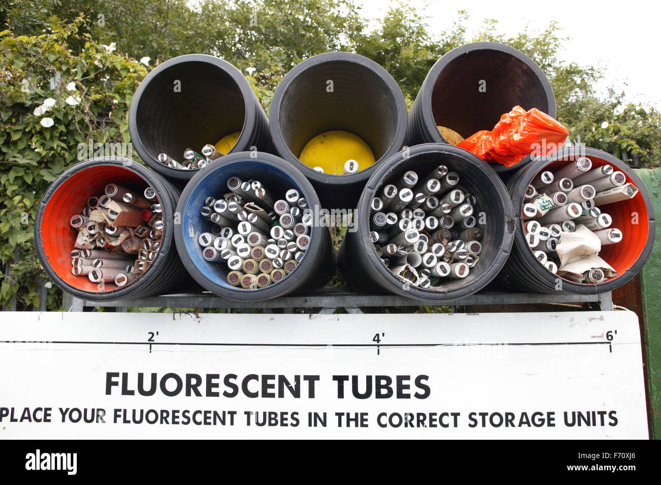 Storage units for recycling florescent tubes at tip Stock Photo - Alamy